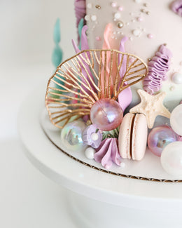 Mermaid Bloom Cake with Tail, Seashells, and Macarons – Earth and Sugar