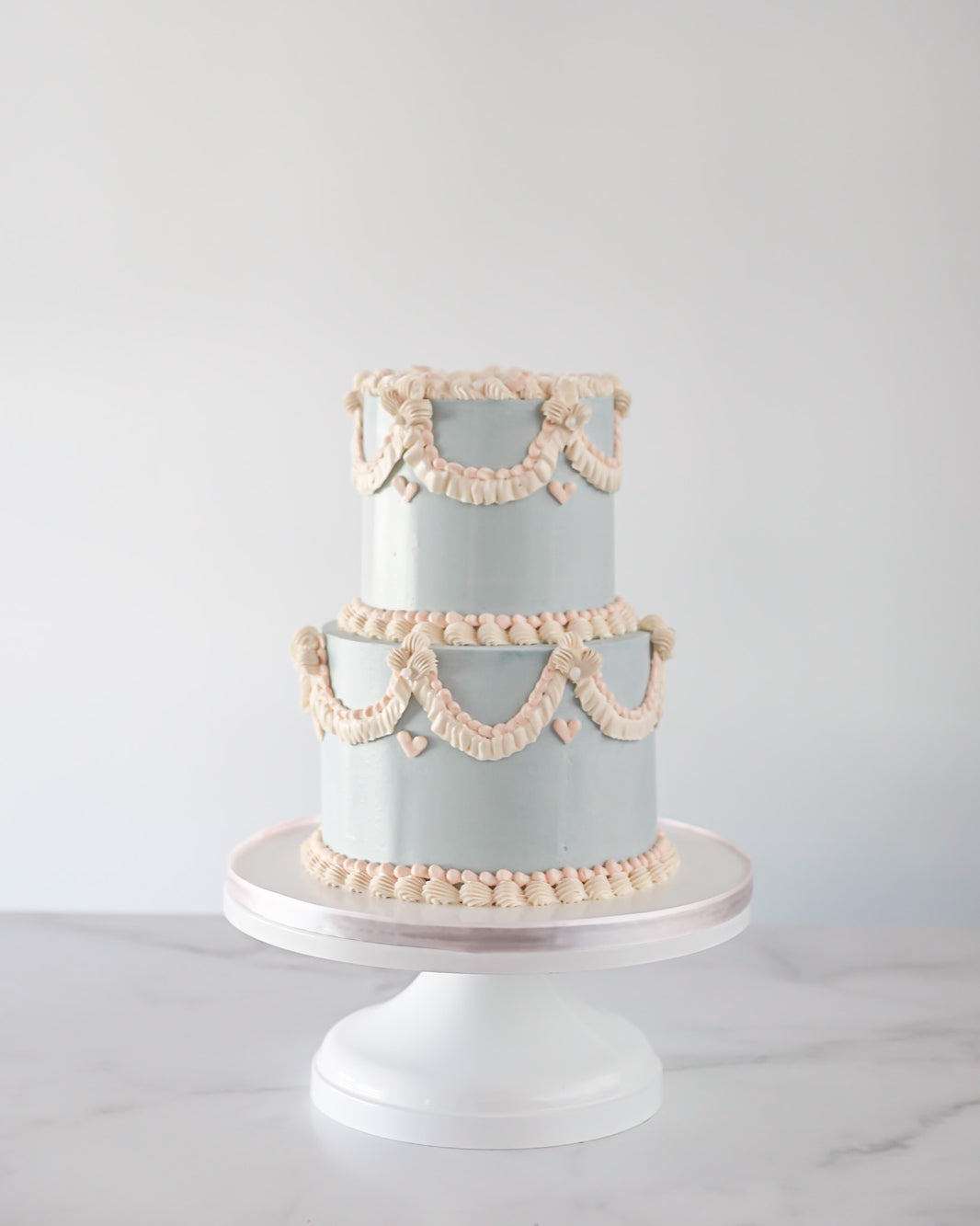 Rosemary Cake with Pastel Hand-Piped Accents – Earth and Sugar